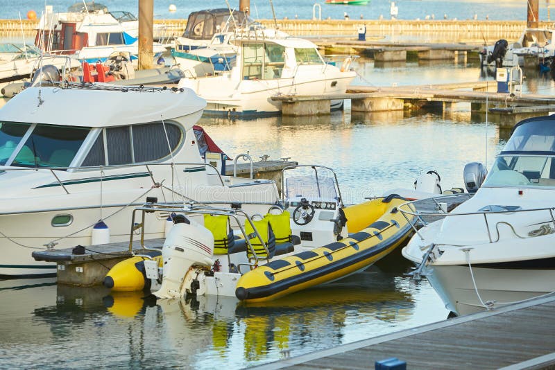 Yellow Inflatable Motor Boat at the Port. Stock Photo - Image of city ...