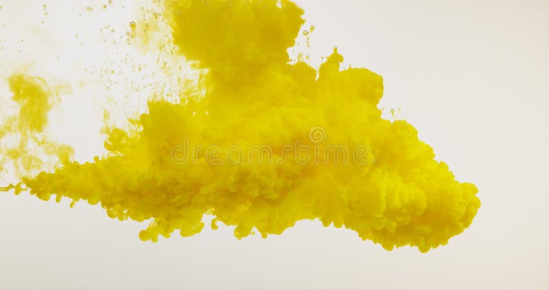 Yellow Ink Entering Water Against White Background Stock Image - Image ...
