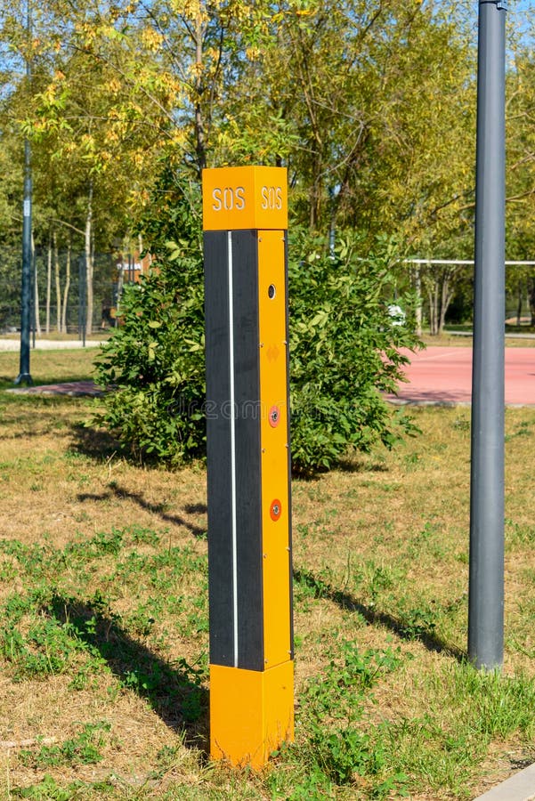 Yellow Intercom in the Park for Emergency Communication on a Pole with ...