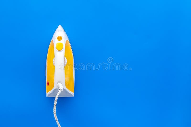 Yellow Iron on Ironing Board. Top View, Copy Space Stock Image - Image ...