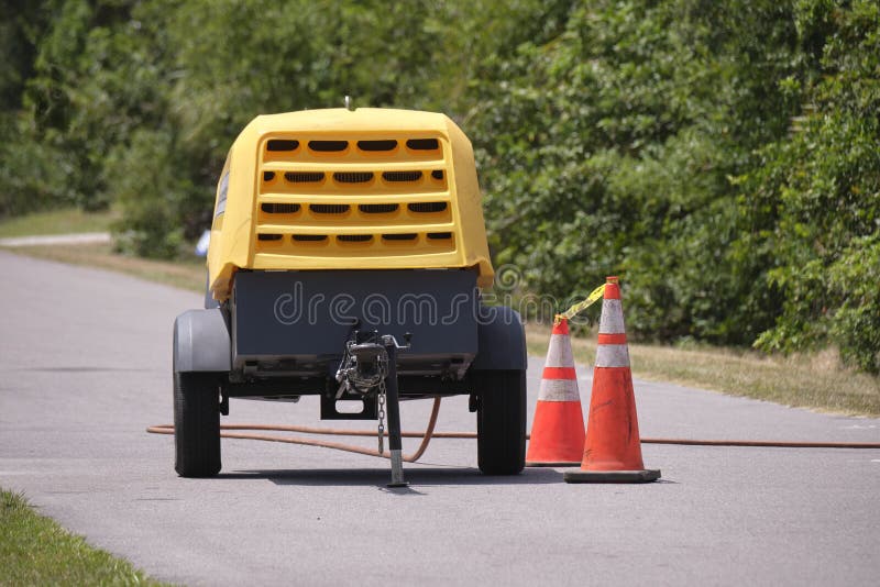 Yellow Jackhammer Machine with Compressor Trailer on Road Construction ...