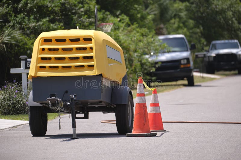 Yellow Jackhammer Machine with Compressor Trailer on Road Construction ...