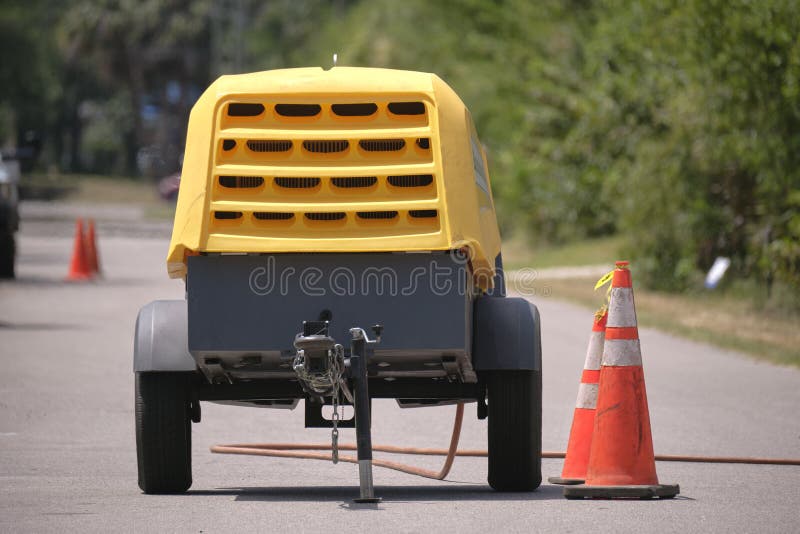 Yellow Jackhammer Machine with Compressor Trailer on Road Construction ...