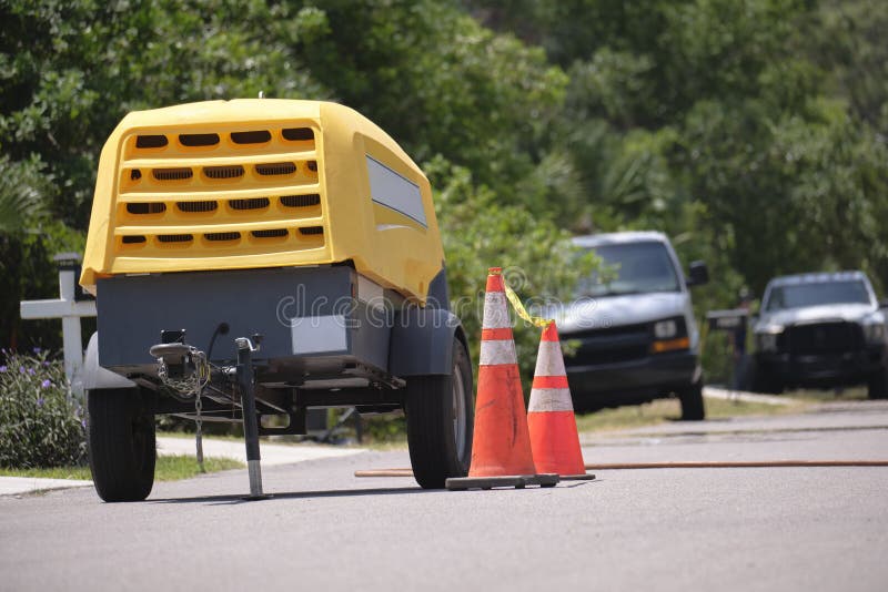 Yellow Jackhammer Machine with Compressor Trailer on Road Construction ...