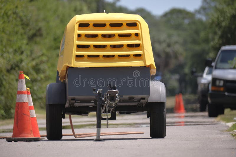 Yellow Jackhammer Machine with Compressor Trailer on Road Construction ...