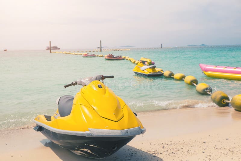Yellow Jet Ski on the Beach. Stock Image - Image of sunny, boat: 95432867