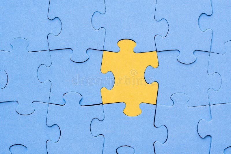 Yellow Jigsaw Puzzle Piece Stands Out from the Crowd Stock Photo ...