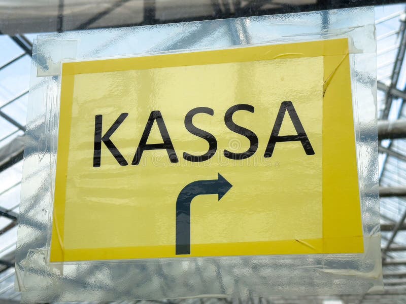 Yellow Kassa Sign with Arrow in Greenhouse Setting Stock Photo - Image ...