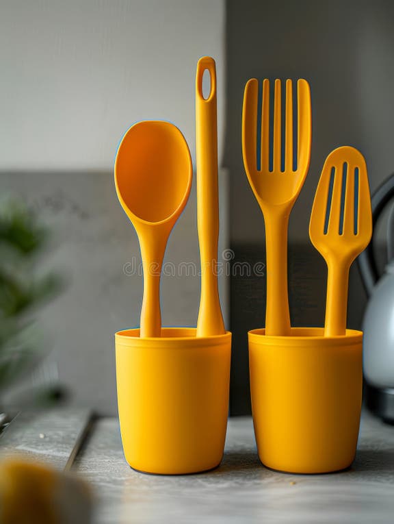 Yellow Kitchen Utensils in Holders on a Modern Kitchen Countertop ...