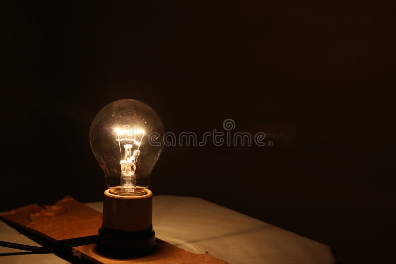 Yellow lamp lit in a room stock photo. Image of glass - 266605536