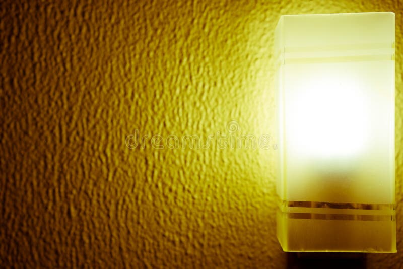 Yellow Lamp Mounted on a Wall in the Dark Night. Stock Photo - Image of ...