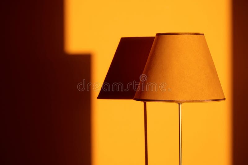 Lamp Shade with Metal Stand Illuminated by Sunset Light with a Harsh ...