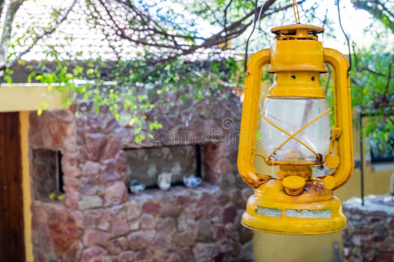 A Yellow Lantern Hanging from a Tree Stock Photo - Image of fuel, dark ...