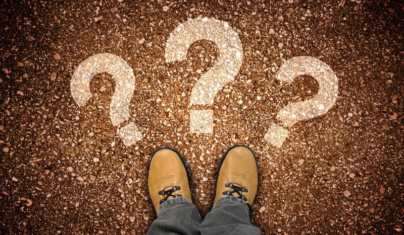 Three Question Marks Written on Wooden Peg Placed Next To a White ...