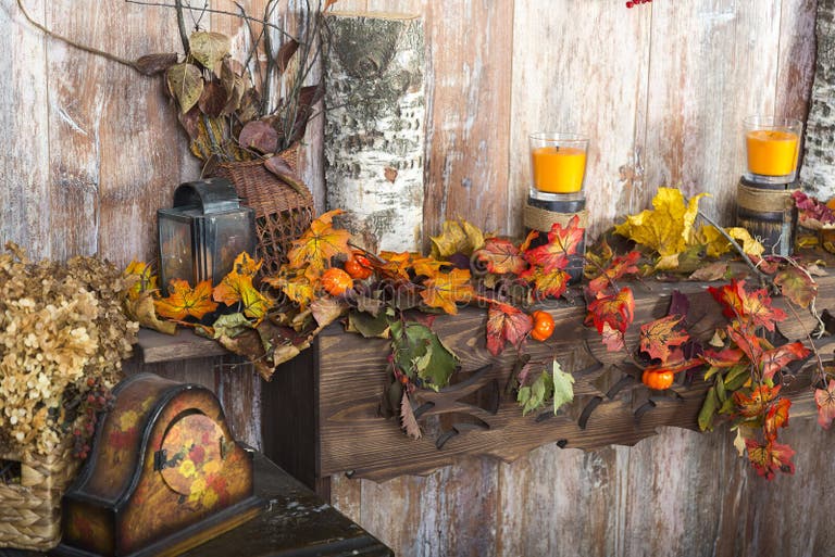 Yellow leaves and candles. stock image. Image of wall - 84557541