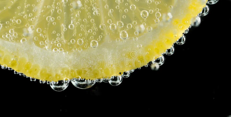 Yellow Lemon with Bubbles on Black Background Stock Image - Image of ...