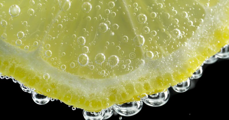 Yellow Lemon with Bubbles on Black Background Stock Photo - Image of ...