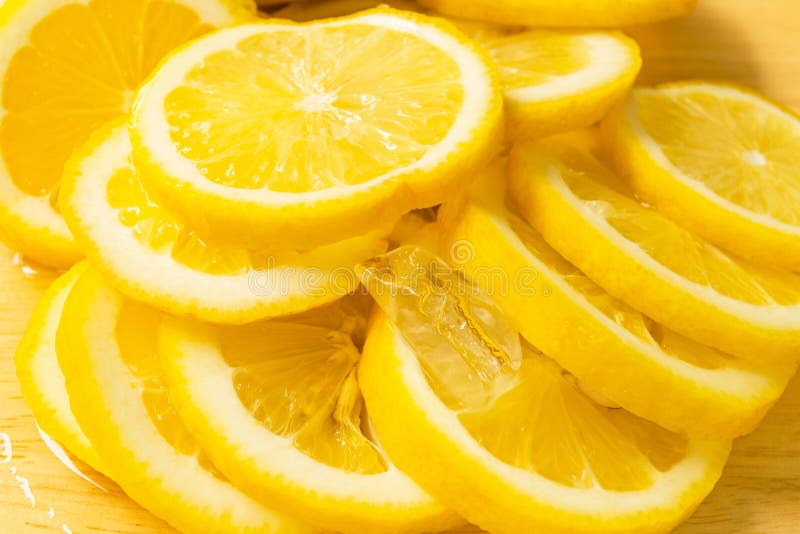 Yellow Lemon Slice into Pieces with Ice Stock Photo - Image of ...