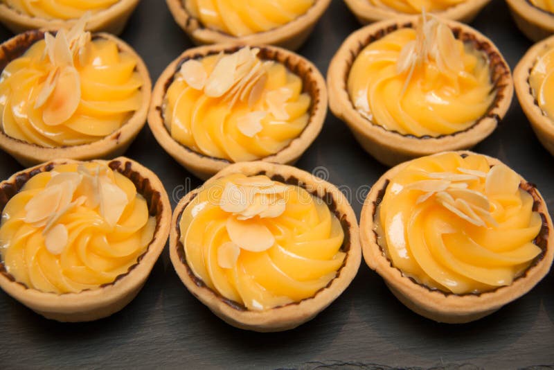 Yellow Lemon Tarts Sit on a Kitchen Baking Tray Stock Photo - Image of ...