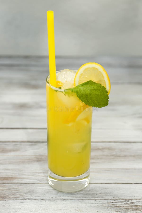Yellow lemonade in a glass stock photo. Image of liquid - 73430642