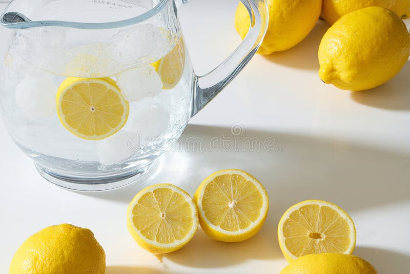 Yellow Lemons and a Clear Glass Pitcher Filled with Ice Water Stock ...