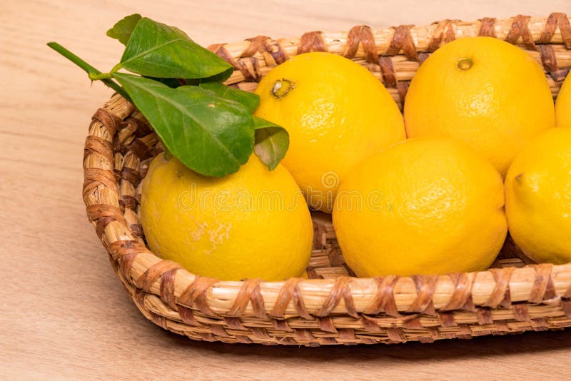 Yellow Lemons in a Small Wooden Basket Stock Image - Image of yellow ...