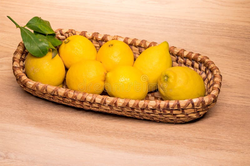 Yellow Lemons in a Small Wooden Basket Stock Photo - Image of ripe ...