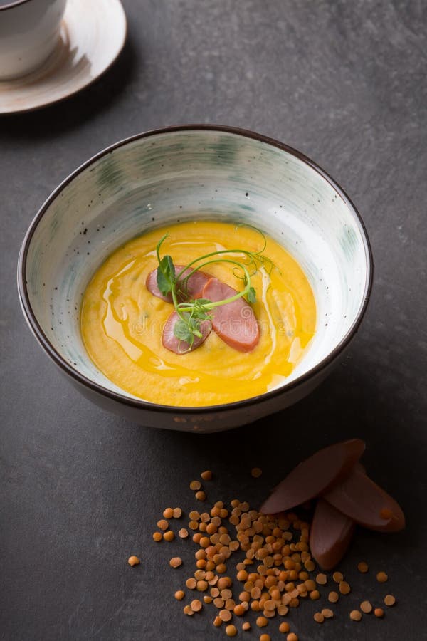 Yellow Lentil Cream Soup Served with Sausage Stock Image - Image of ...