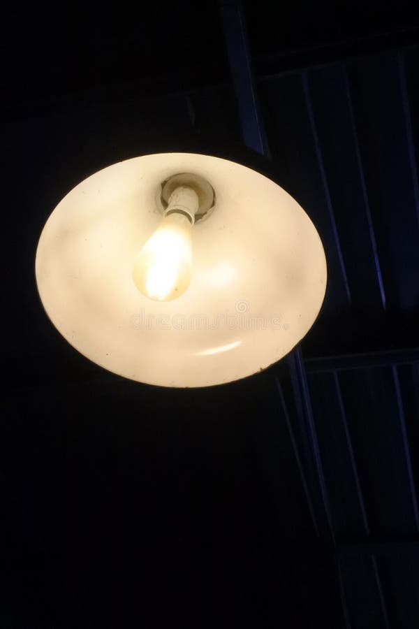 Yellow light bulb at night stock image. Image of wheel - 390781661