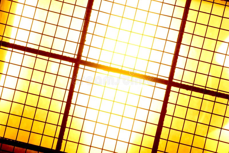 Yellow Light with an Iron Grid in Front Stock Photo - Image of grid ...