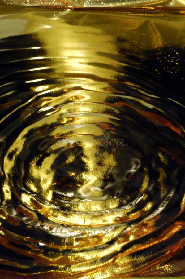 Yellow Light Reflecting on Water Ripples or Waves Stock Photo - Image ...