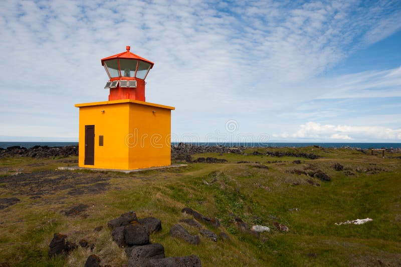 Yellow Lighthouse in Iceland Stock Photo - Image of seascape, rock ...