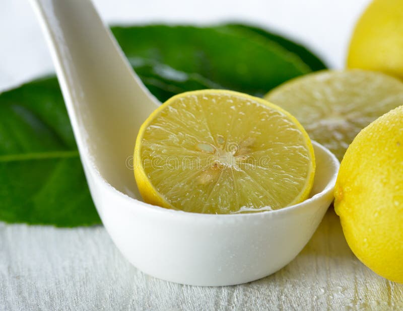 Yellow lime on white spoon stock image. Image of ripe - 119536349