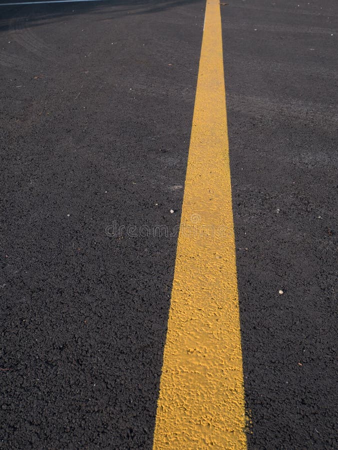 Yellow Line Across Dark Asphalt Stock Image - Image of perspective ...