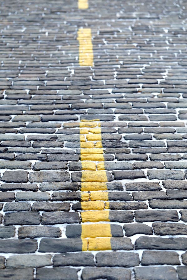 The Yellow Line on the Pavement Stock Photo - Image of reflection, city ...