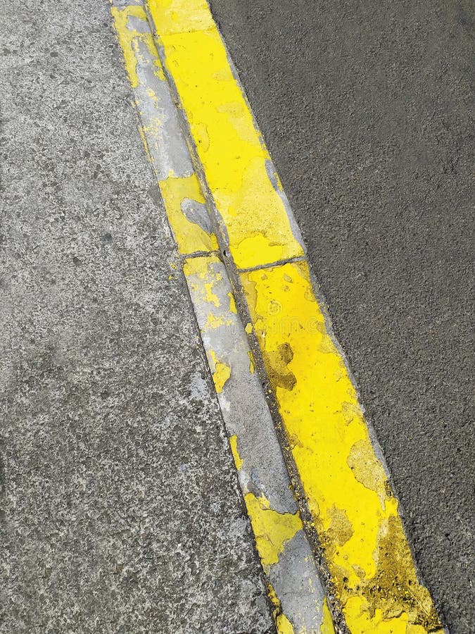 Yellow Line In Poor Condition On Asphalt Road Texture Background ...