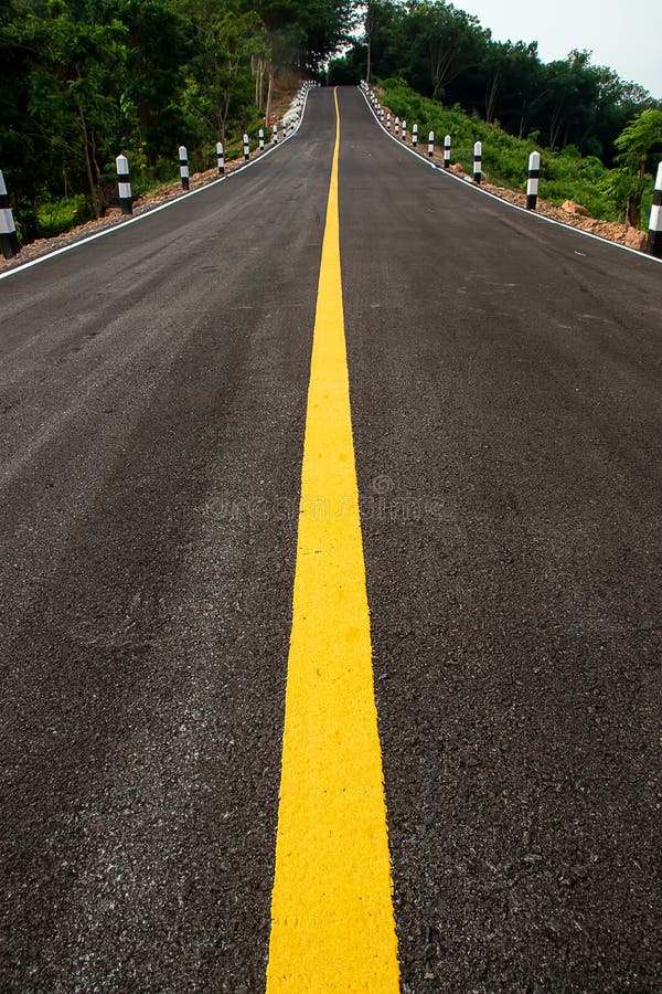 Yellow line on the road stock image. Image of paint - 284507247