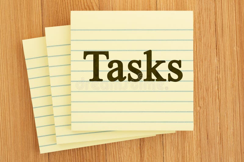 Yellow Lined Sticky Notes with Tasks Written on Wooden Desk Stock Photo ...