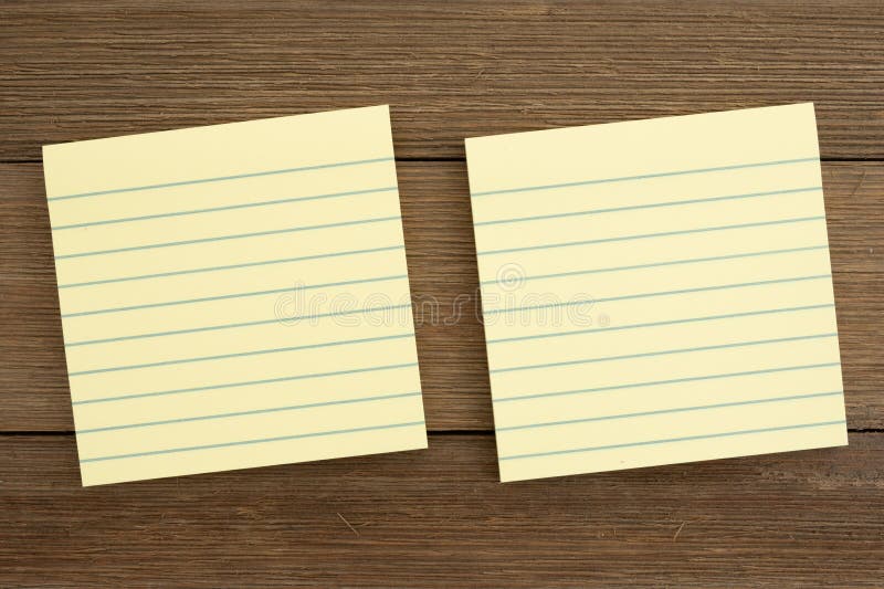 Yellow Lined Sticky Notes on Weathered Wood Stock Photo - Image of ...