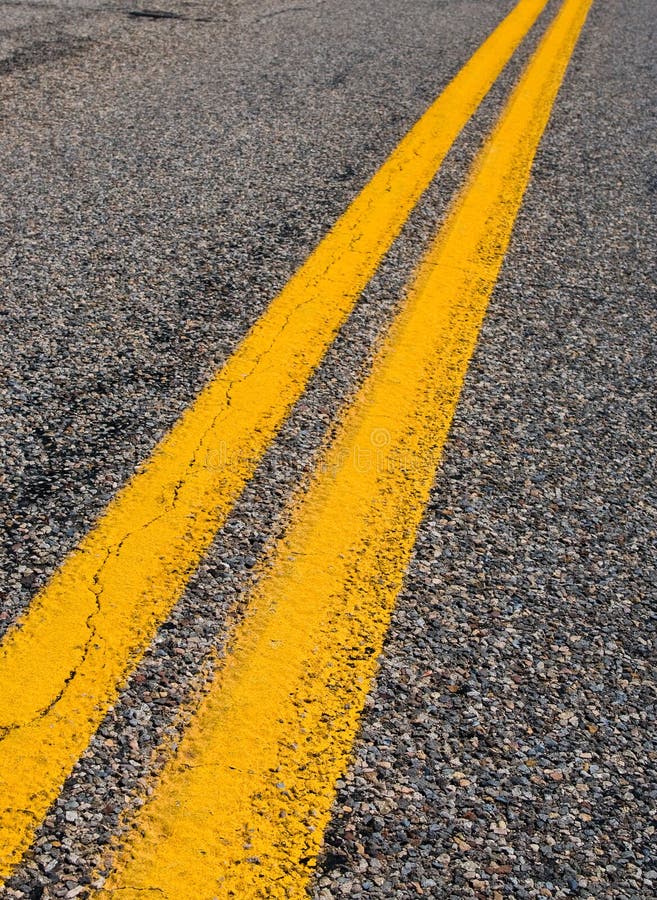 Yellow Double Dividing Line Over Black Highway Asphalt Stock Photo ...