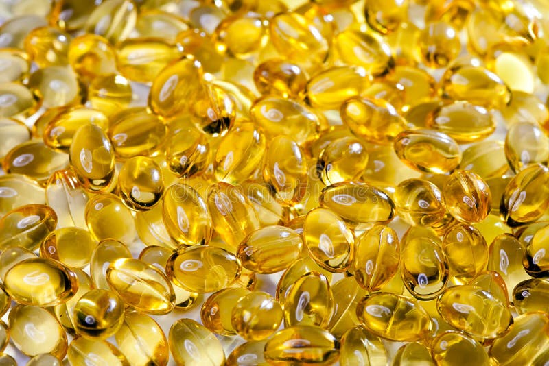 Yellow Liquid Capsules Lie Near a Bottle Stock Image - Image of ...