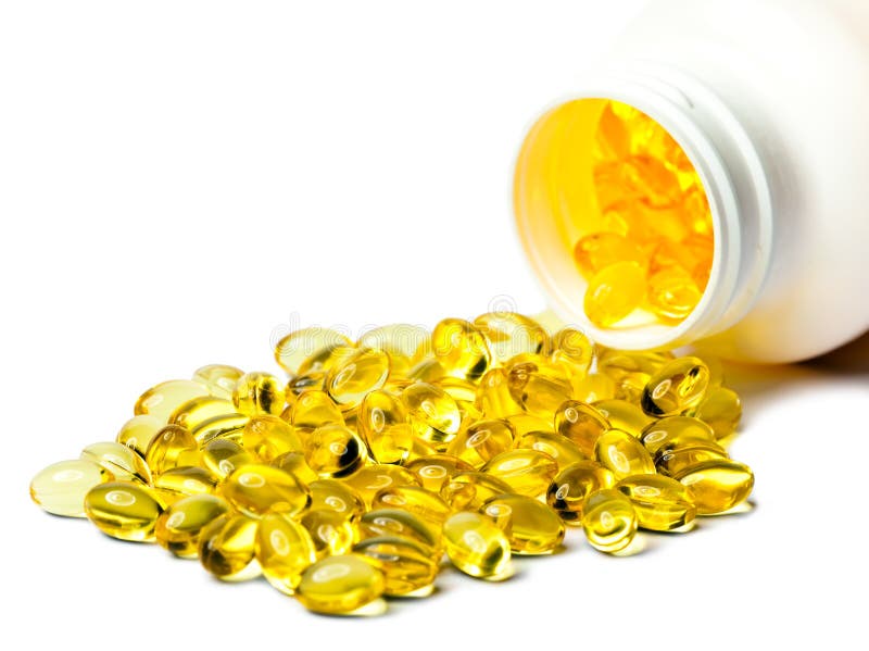 Yellow Liquid Capsules Lie Near a Bottle Stock Image - Image of ...