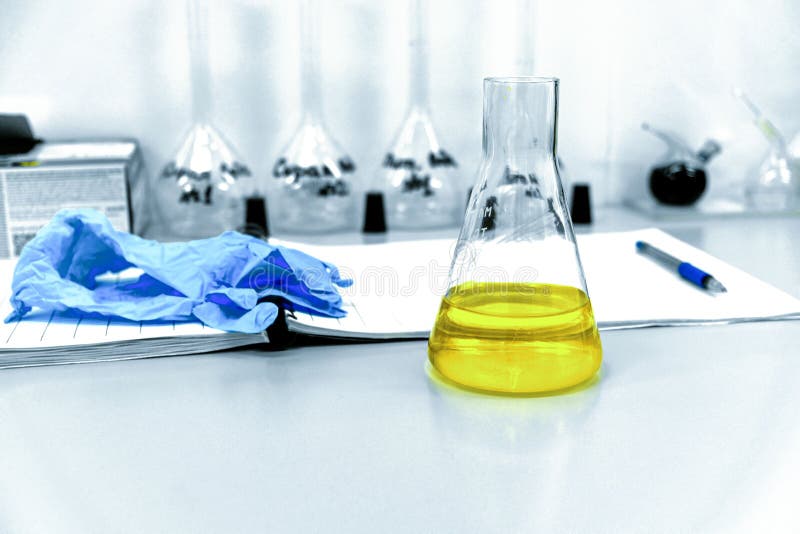 The Yellow Liquid in the Flask is on the Table in the Laboratory Stock ...