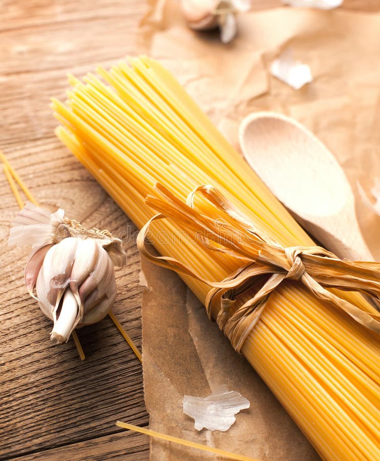 Yellow Long Spaghetti on a Rustic Background. Yellow Italian Pasta ...