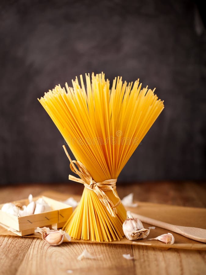 Yellow Long Spaghetti on a Rustic Background. Yellow Italian Pasta ...