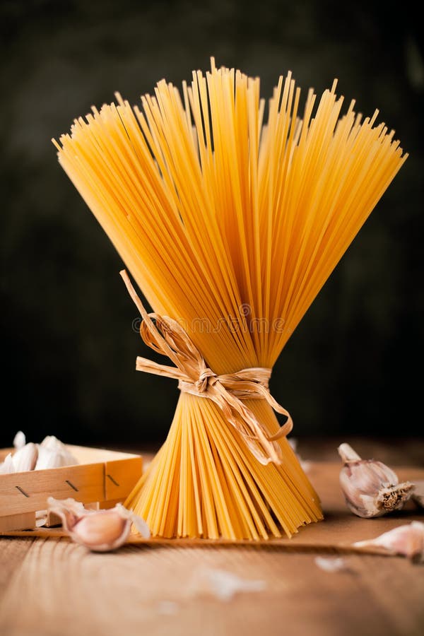 Yellow Long Spaghetti on a Rustic Background. Yellow Italian Pasta ...