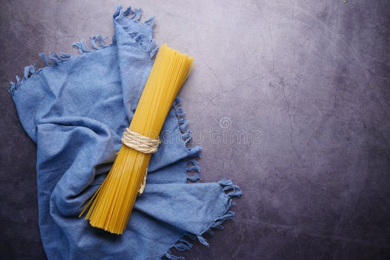 Yellow Long Spaghetti and a Table Cloth on Black Background Stock Image ...