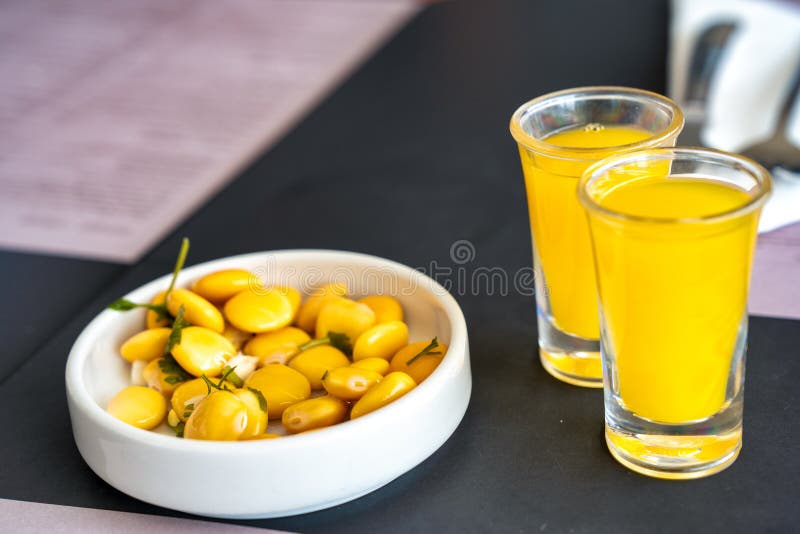 Yellow Lupin Beans with Orange Beverage, Aperitif Stock Image - Image ...