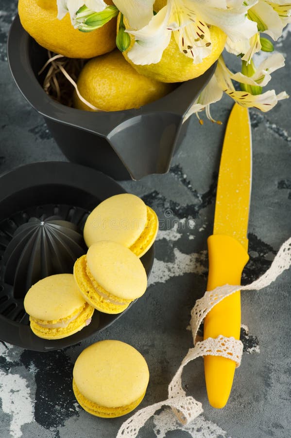 Yellow Macaroons with Lemons in Background Stock Photo - Image of ...
