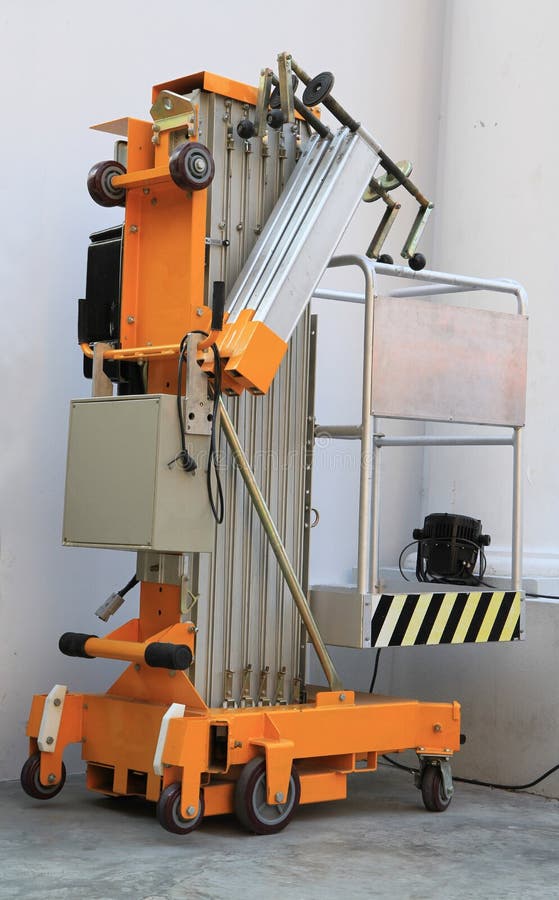 Yellow machine stock image. Image of lift, tall, pulley - 29600439